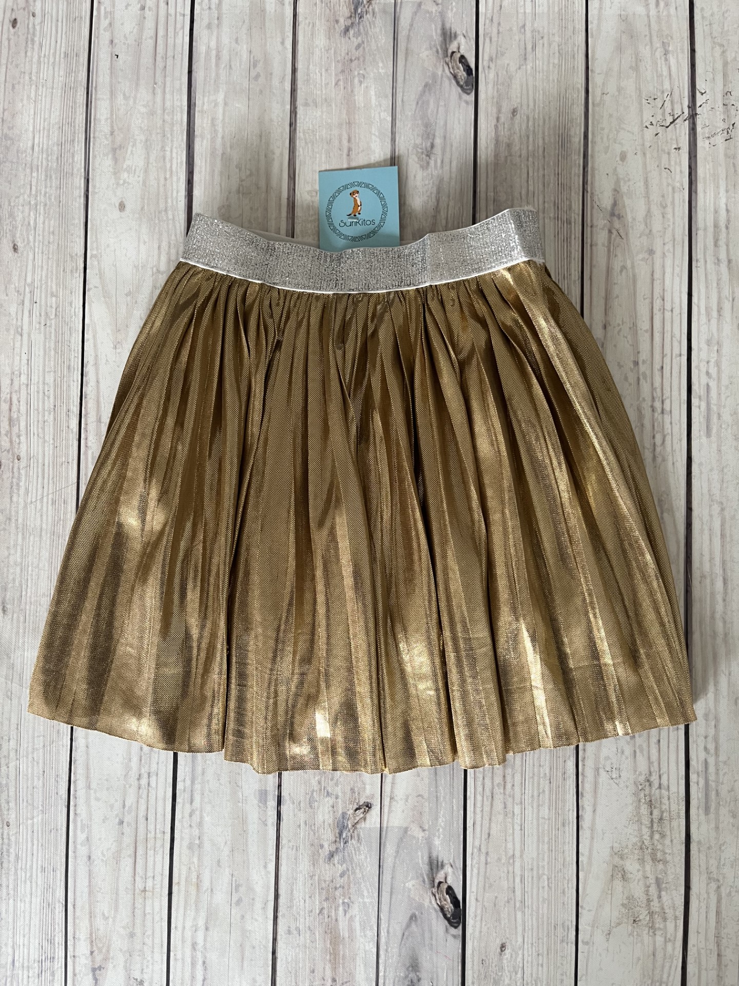 POLLERA METALIZADA DORADA . LINEA IMPORTADA – Surikitos